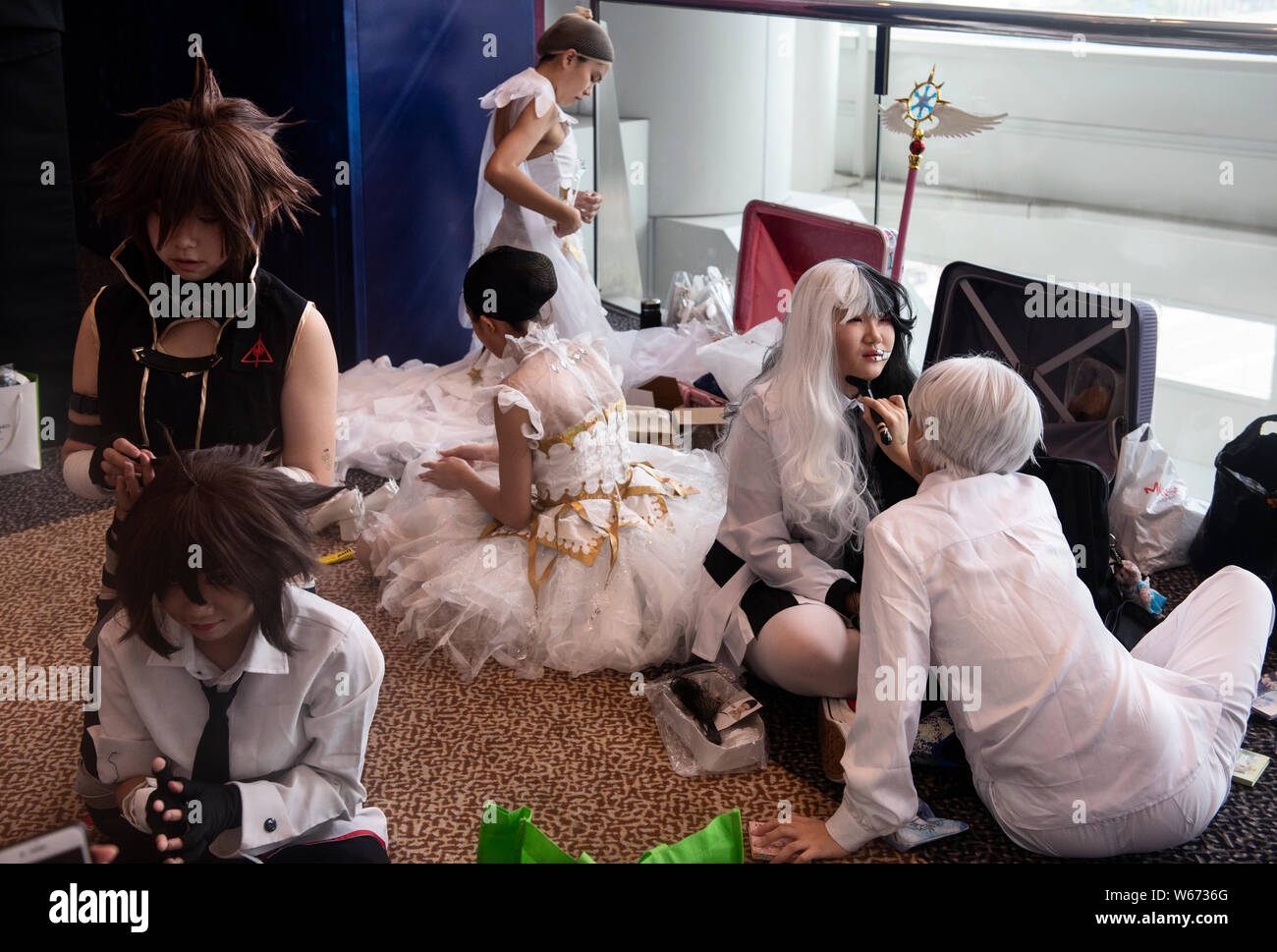 Cosplayers get dressed and make-up done during the Ani-com and E-Sports ...
