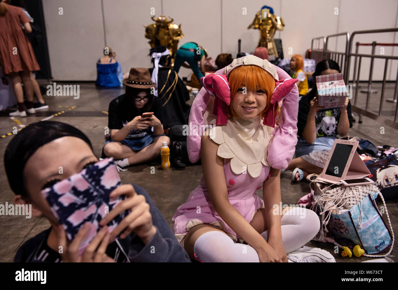Cosplayers get dressed and make-up done during the Ani-com and E-Sports ...