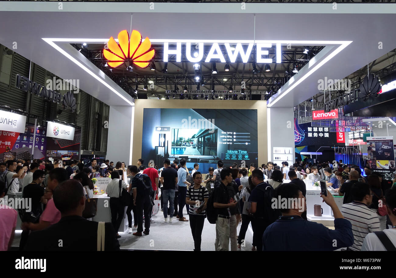 --FILE--People visit the stand of Huawei during an exhibition in ...