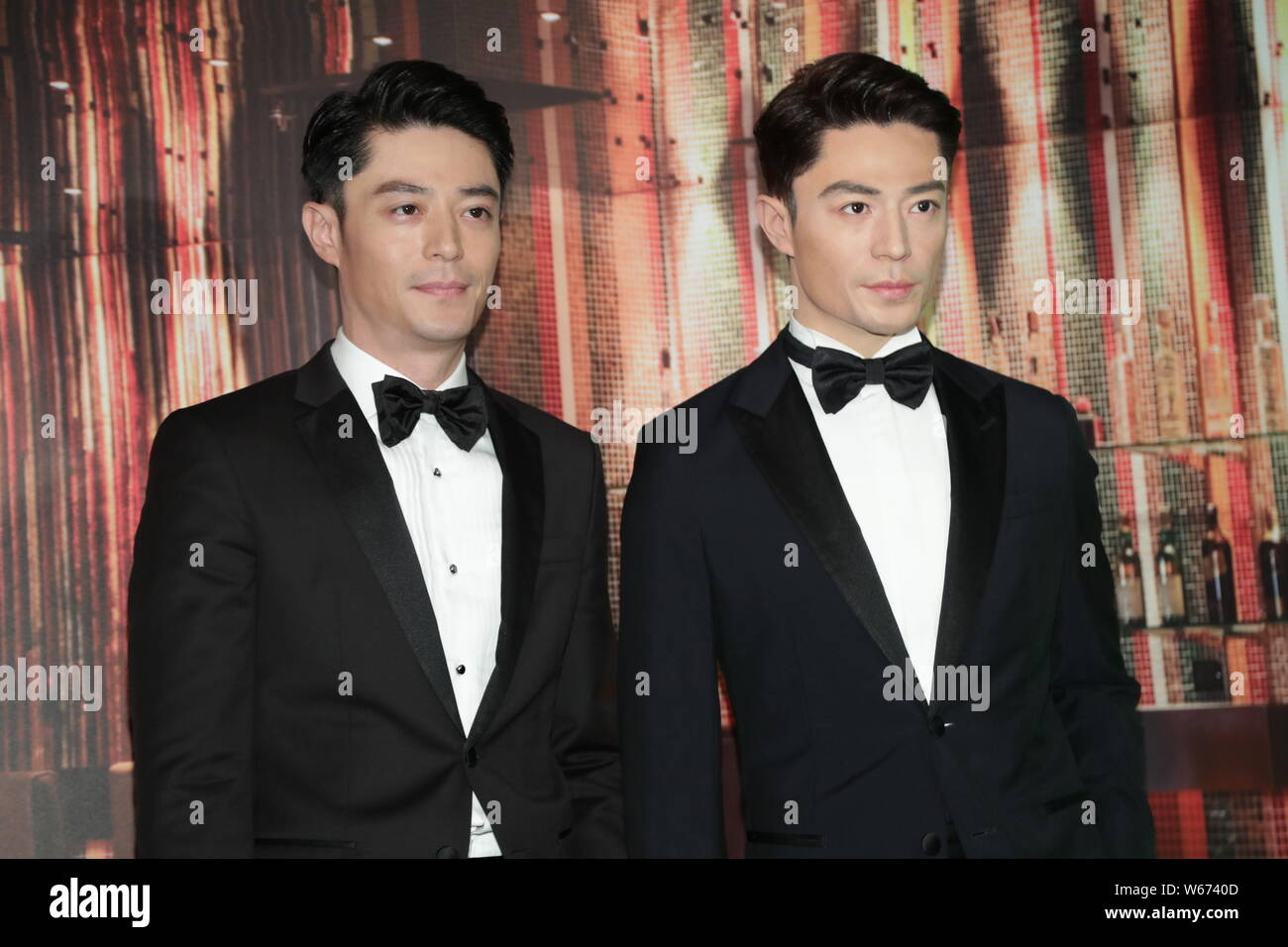 Taiwanese actor Wallace Huo, left, poses with a wax figure of him ...