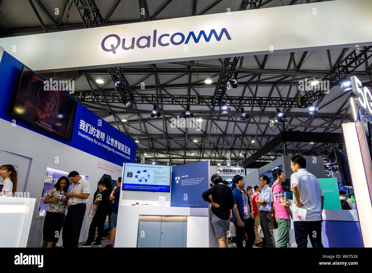 --FILE--People visit the stand of Qualcomm during the 2018 Mobile World ...