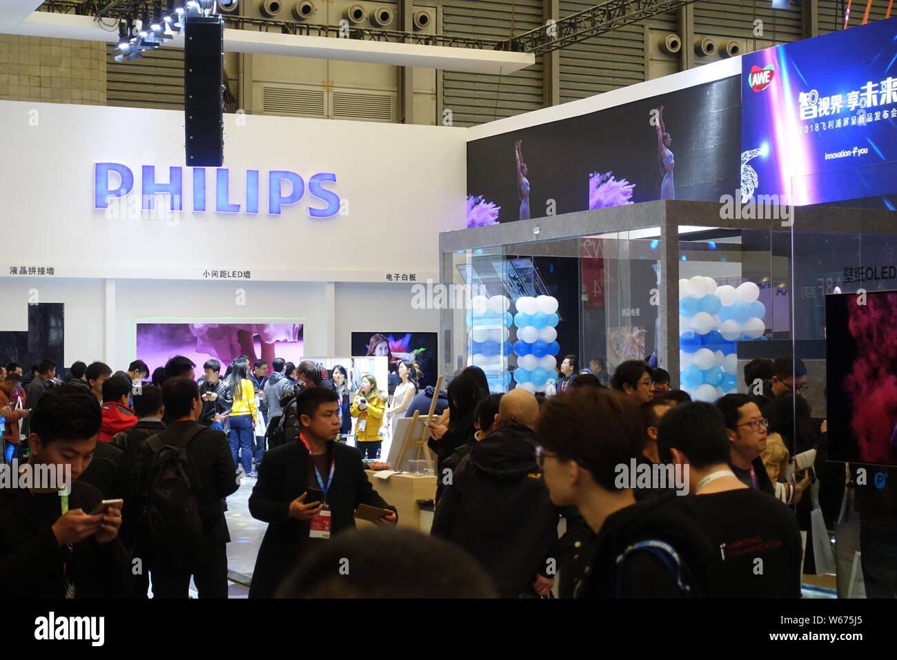--FILE--People visit the stand of Philips during a fair in Shanghai ...