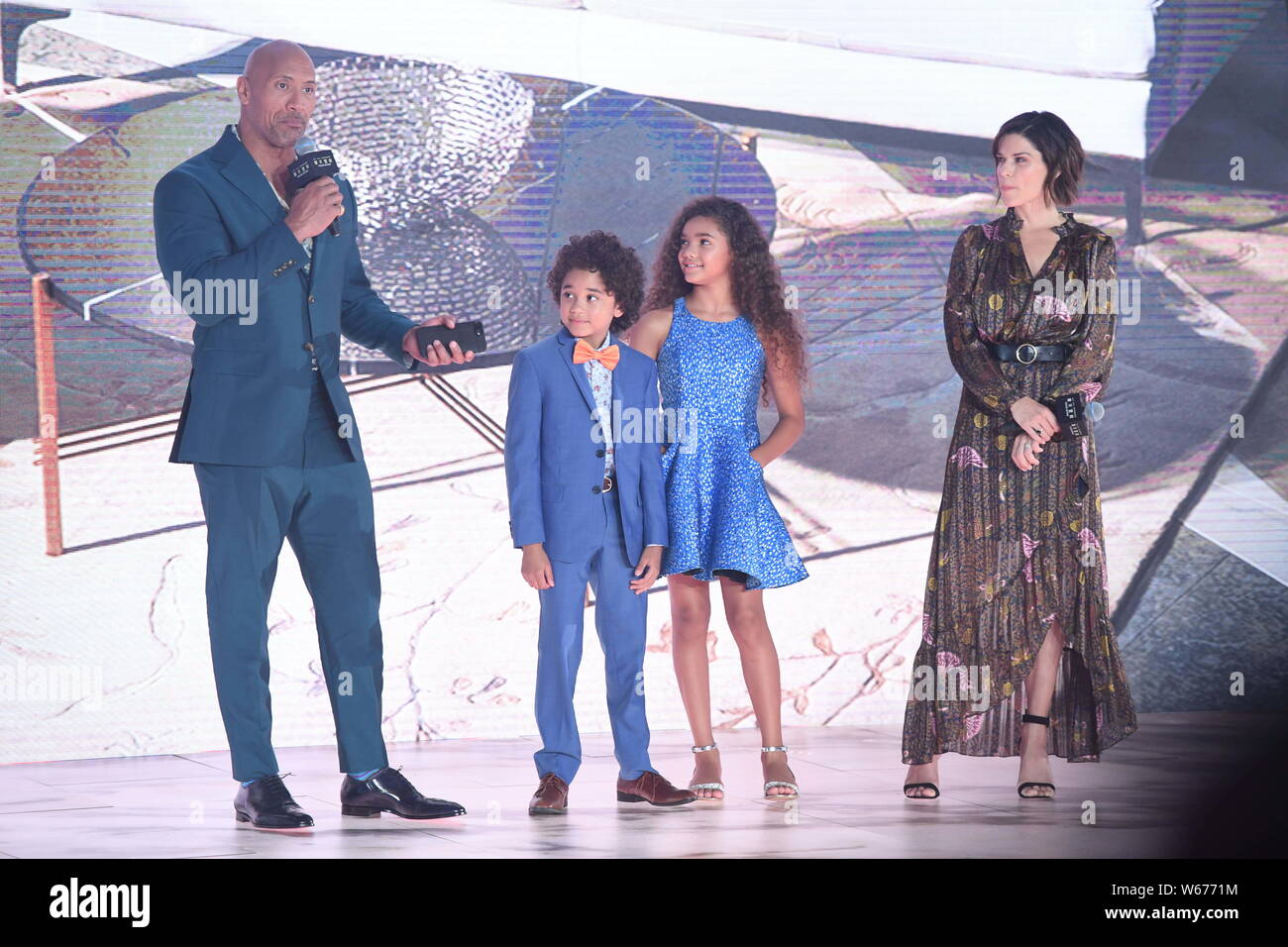 (From left) American actor Dwayne Johnson, child stars Noah Cottrell ...