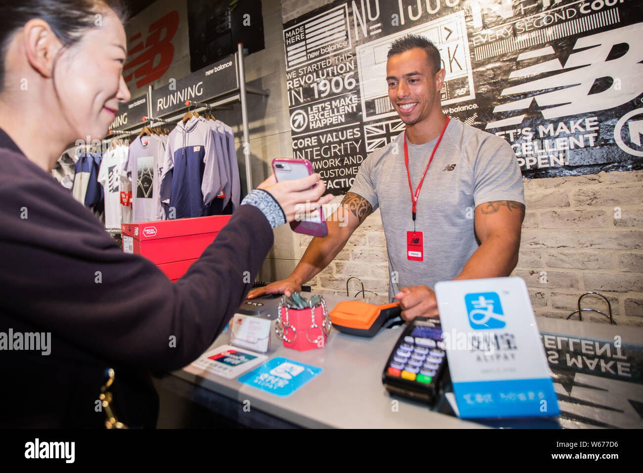 --FILE--A customer have the QR code on her smartphone scanned via ...