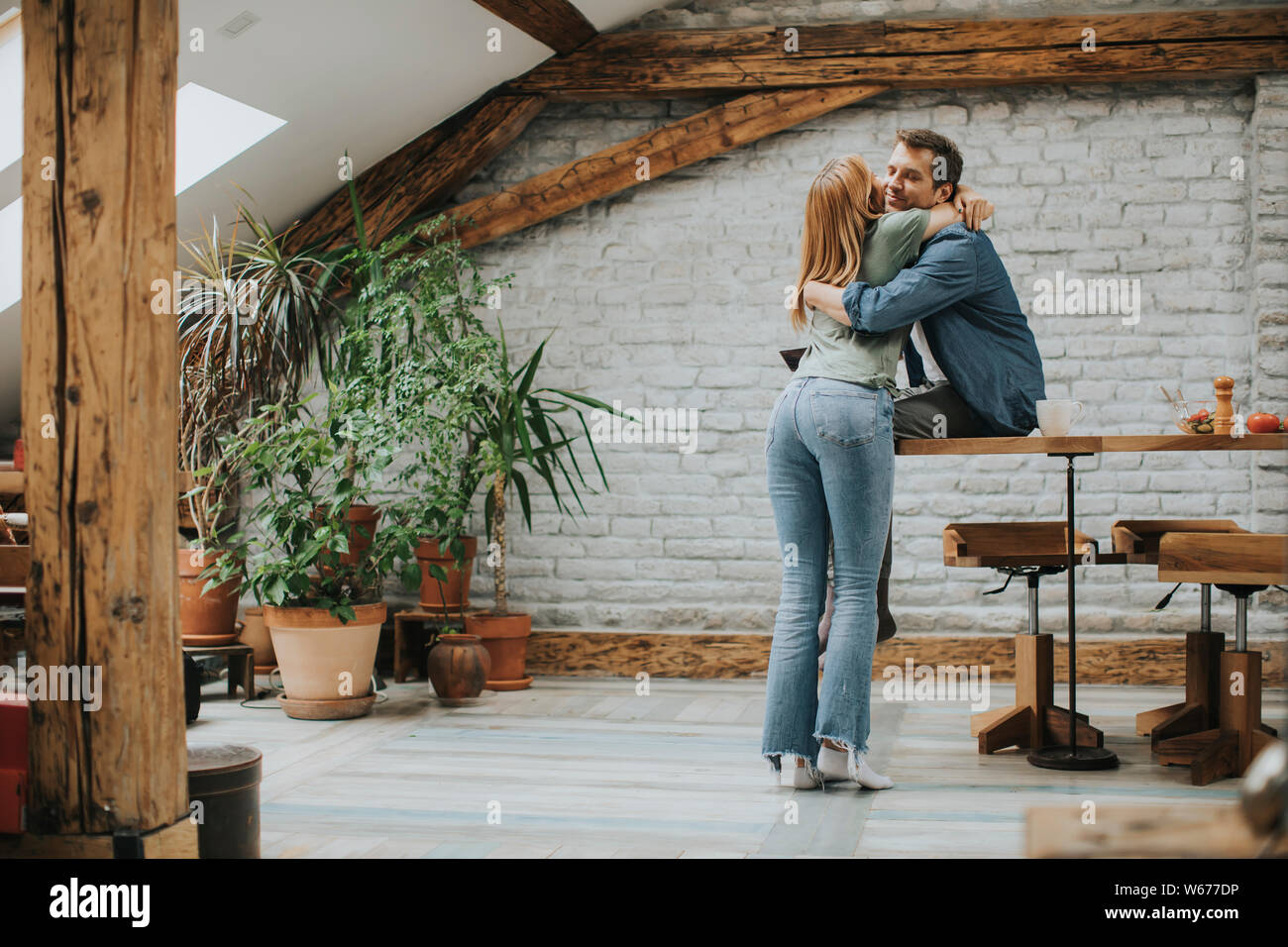 Beautiful couple hugging in kitchen hi-res stock photography and images ...