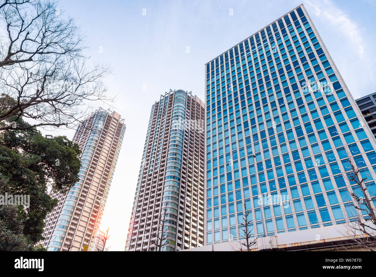 Modern residential and office buildings in Tokyo city centre at sunset ...