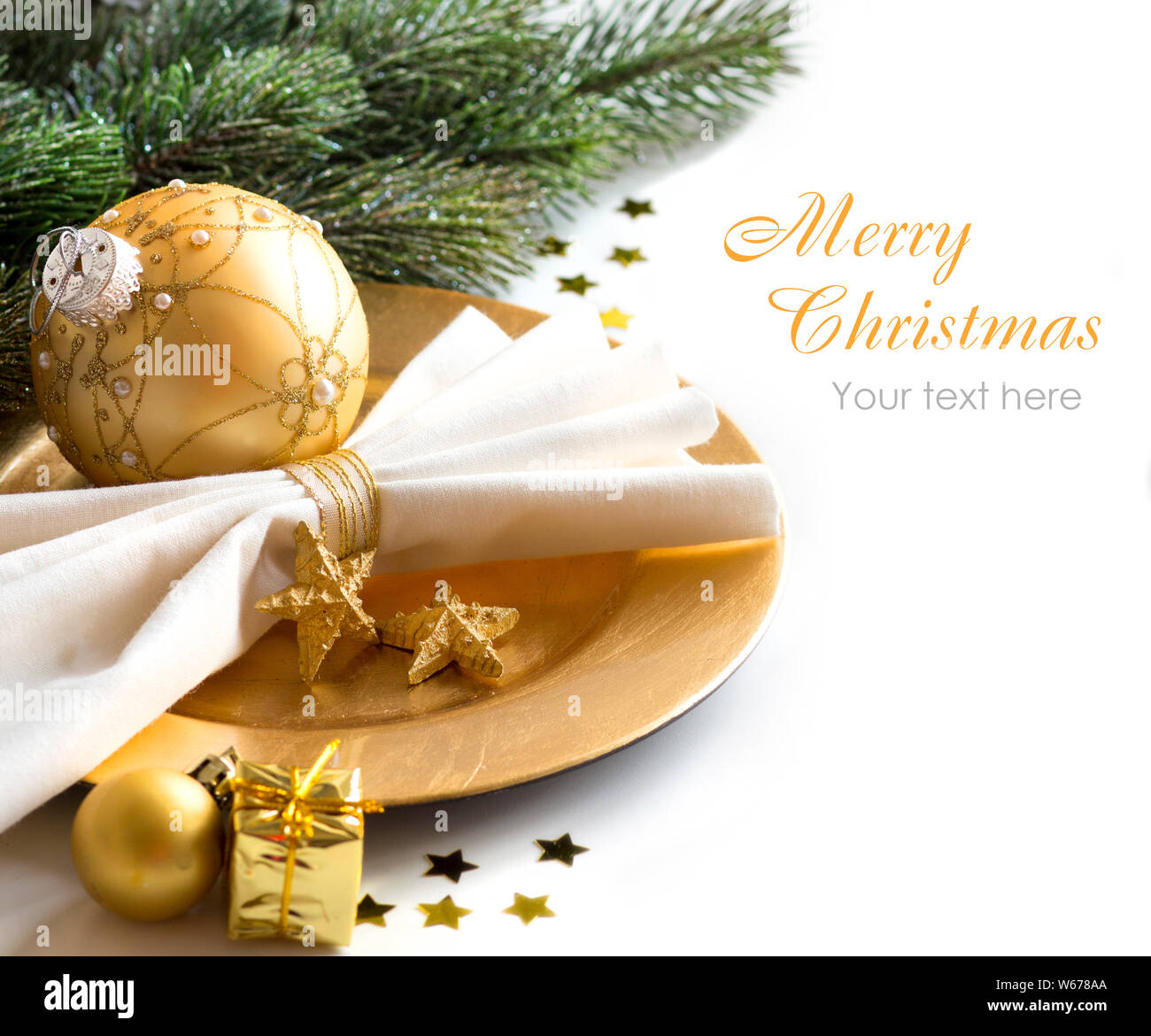 Festive table setting with golden bauble and plate Stock Photo - Alamy