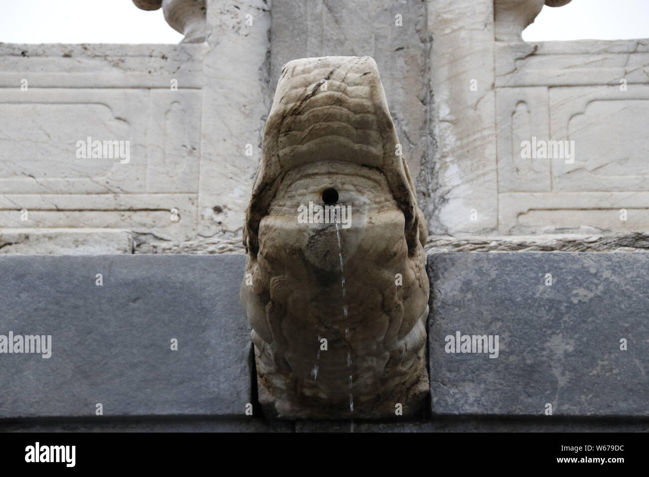 Rainwater flows from a dragon-shaped drainage gutter the Palace Museum ...
