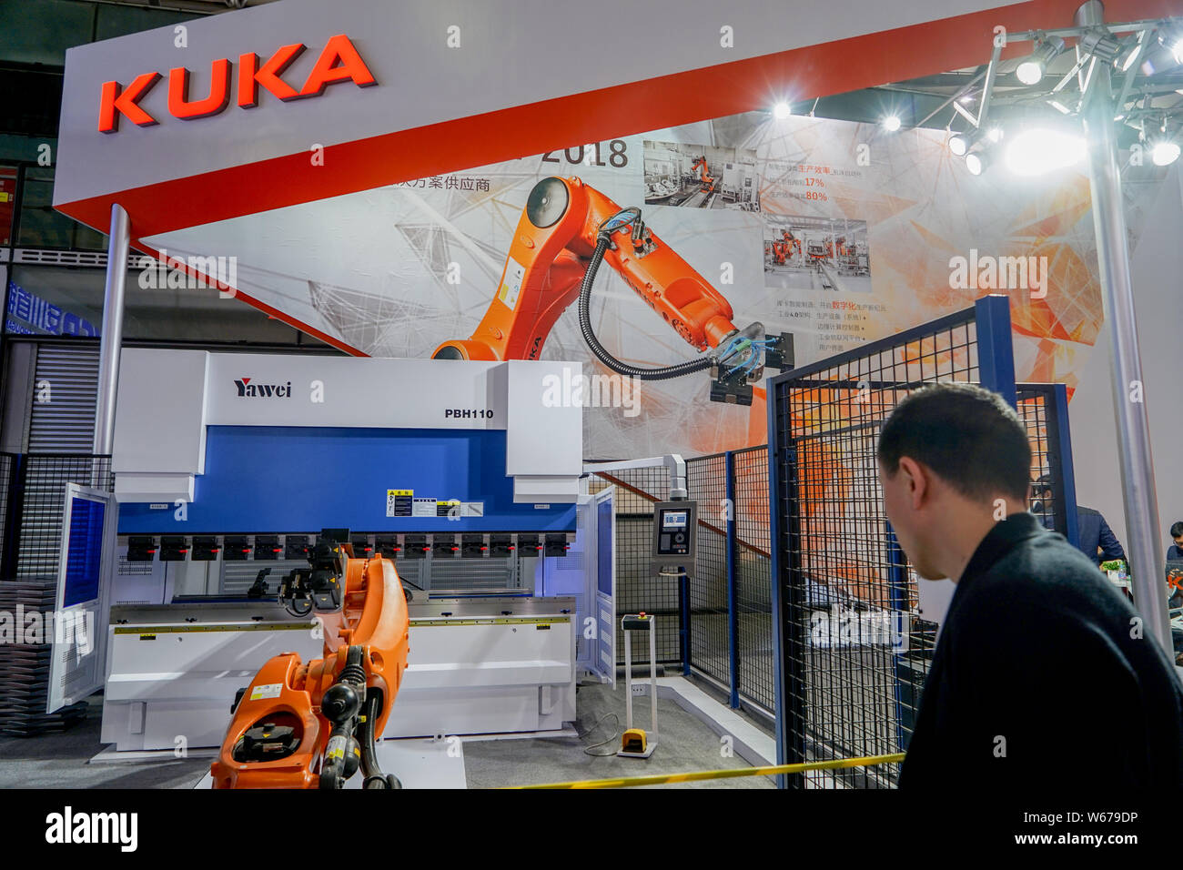 --FILE--People visit the stand of German robot maker KUKA during an exhibition in Shanghai ...