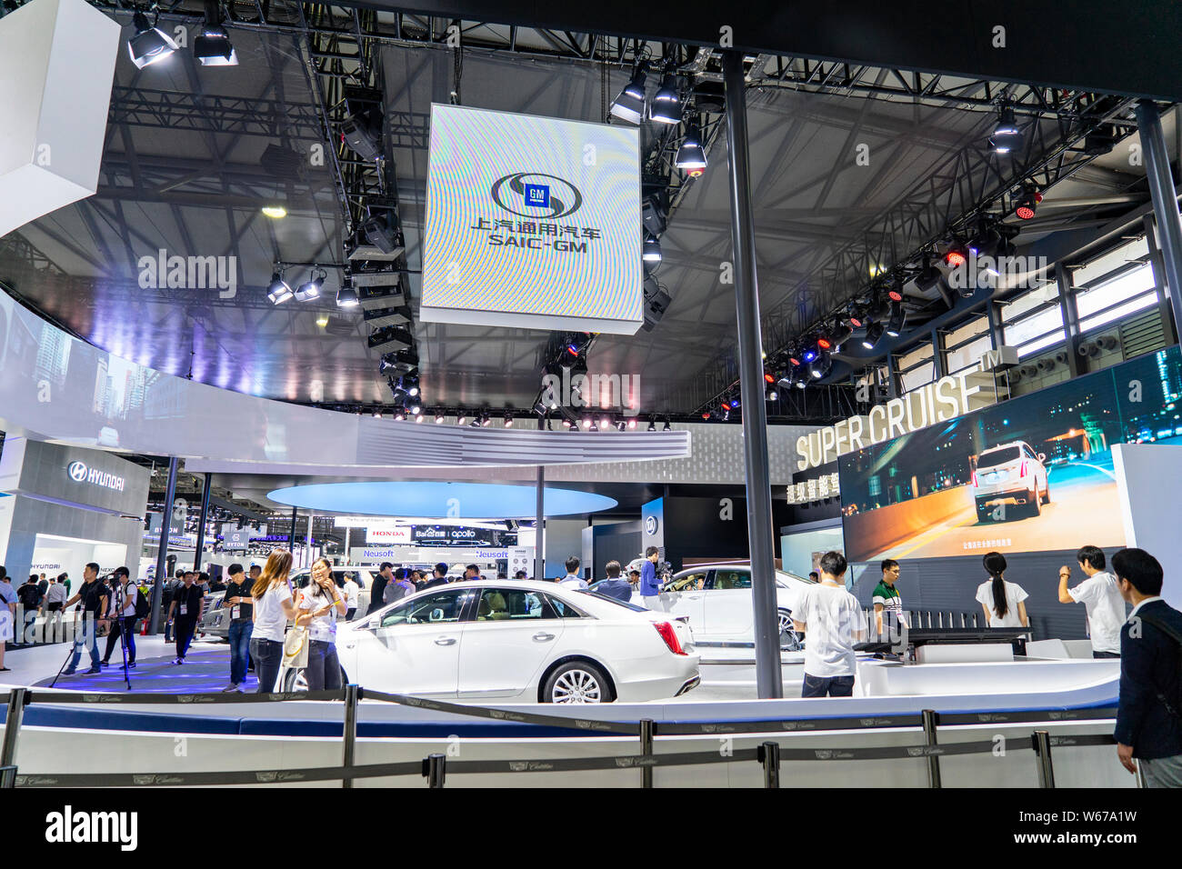 --FILE--People visit the stand of SAIC-GM, a joint venture between SAIC ...