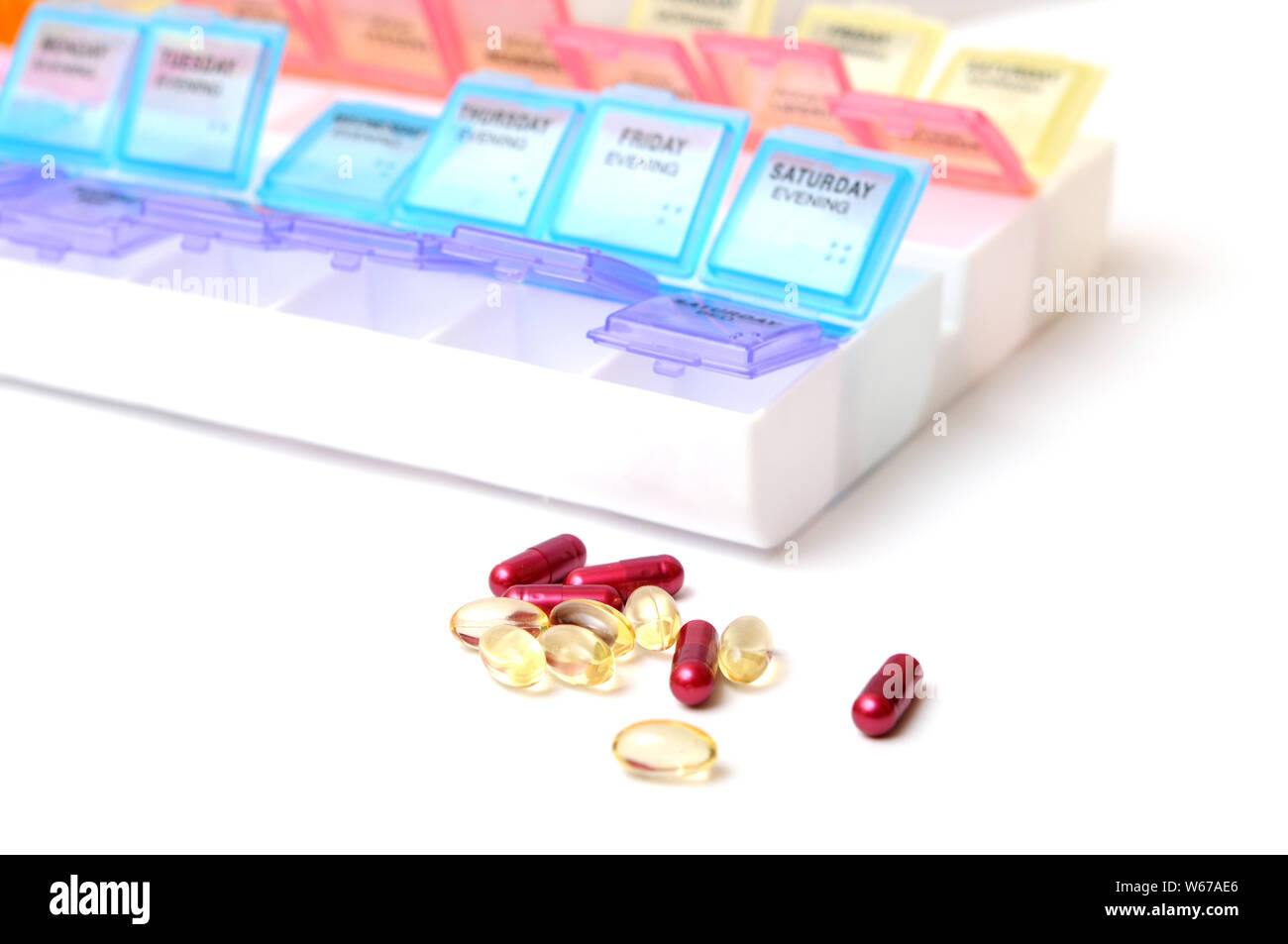 medicines and schedule plastic box on white Stock Photo - Alamy