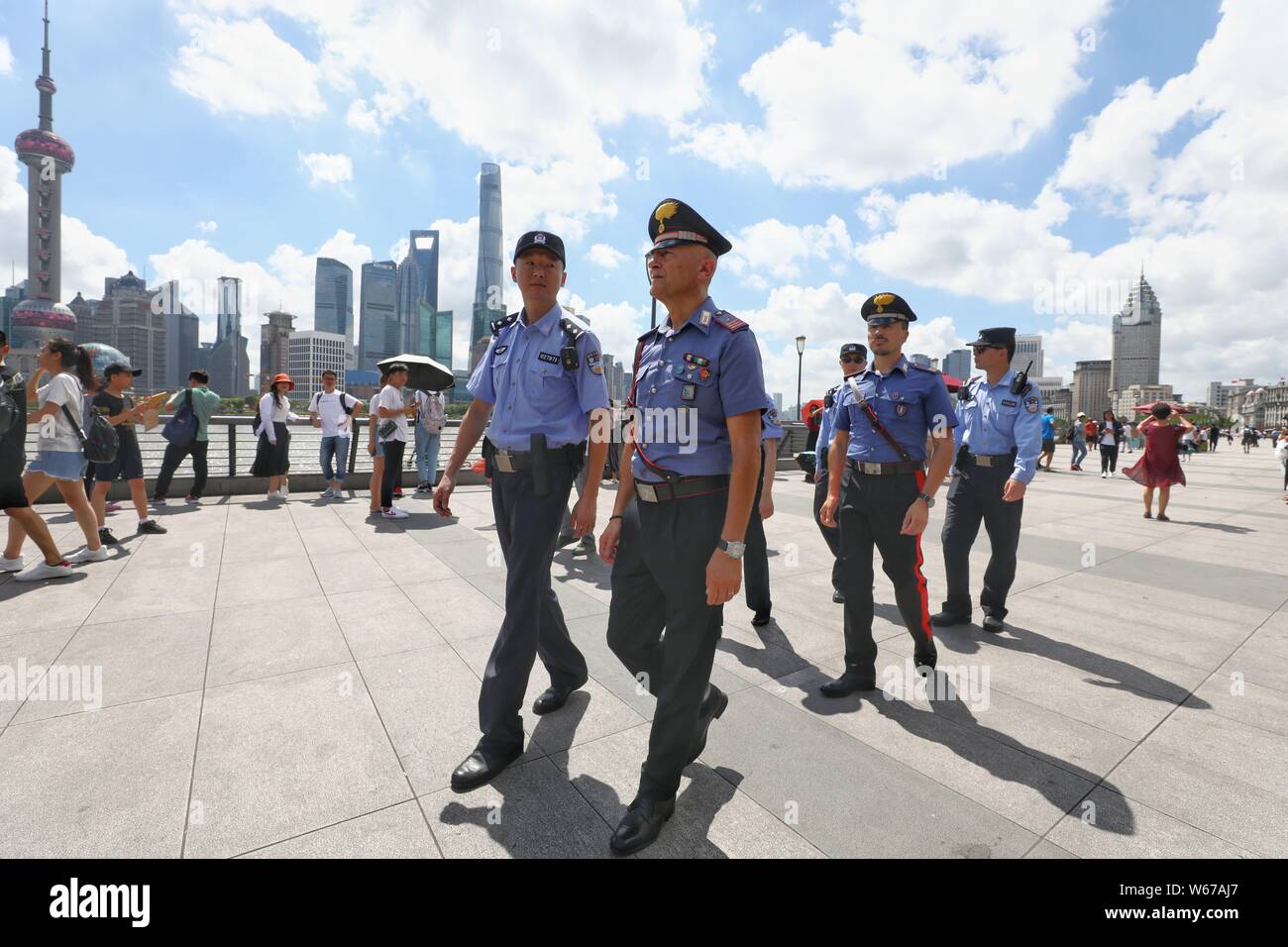 Two Italian police officers conduct joint patrols with Chinese police ...