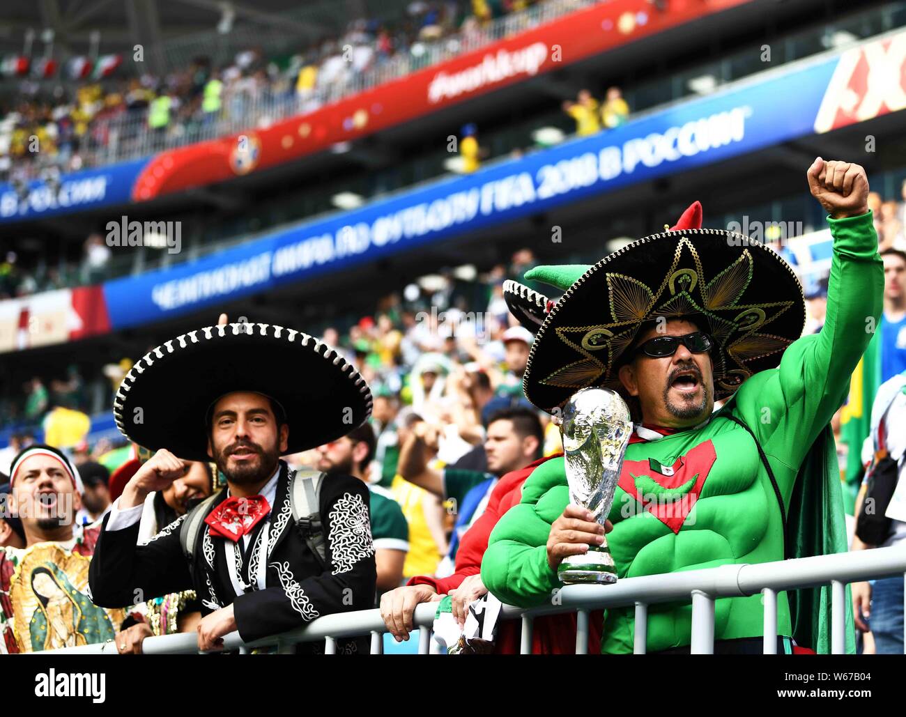 Mexican fans shout to show their support for Mexico before the Round of ...