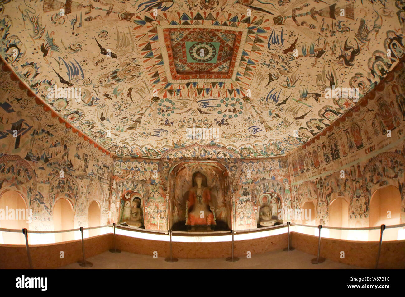 View of the replica of frescoes in the No. 285 grotto of the Mogao Caves during the Dunhuang Art ...