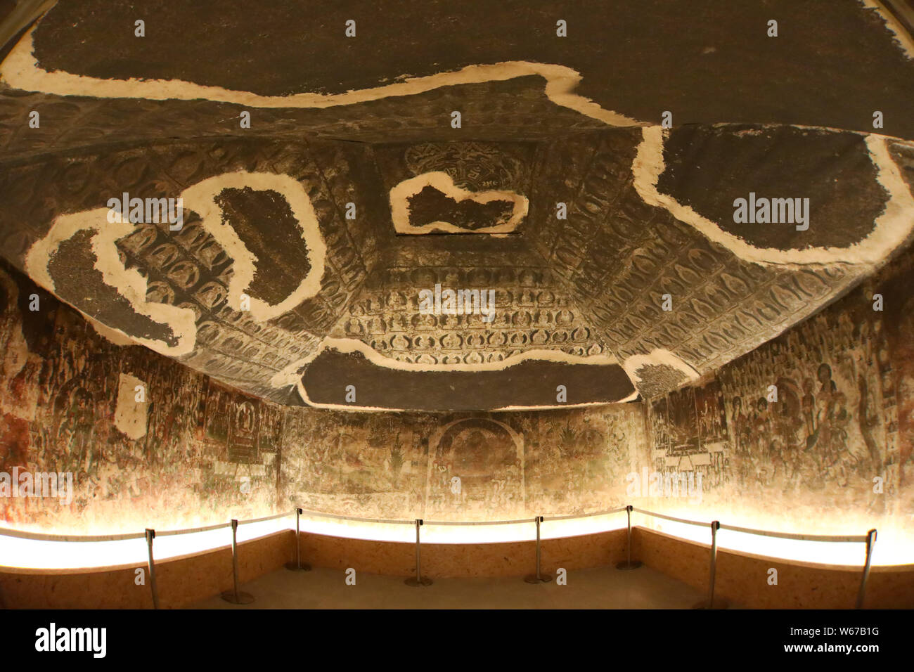 View of the replica of frescoes in the No. 285 grotto of the Mogao Caves during the Dunhuang Art ...