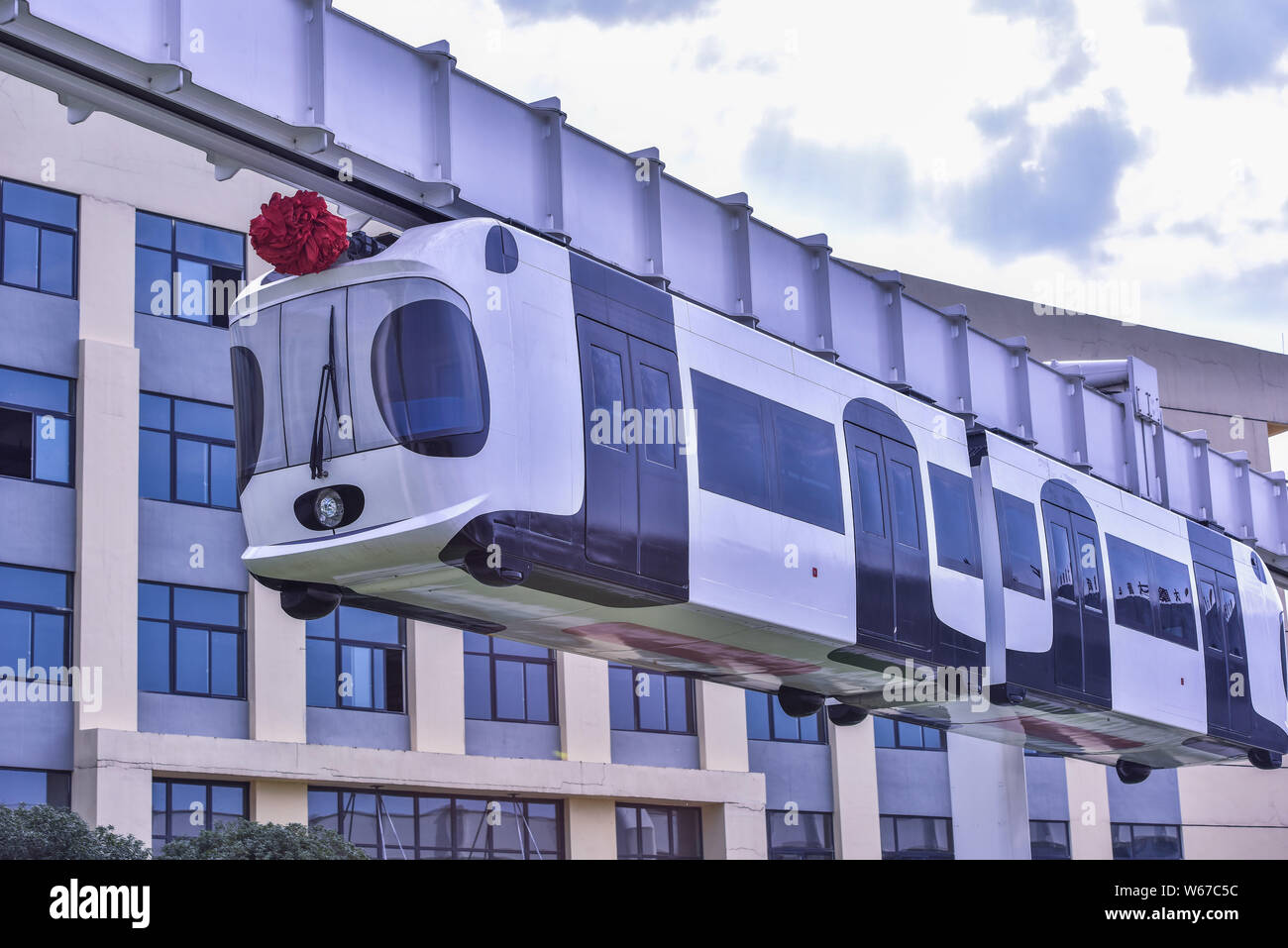 An elevated new energy monorail suspended "Sky Train" decorated to ...
