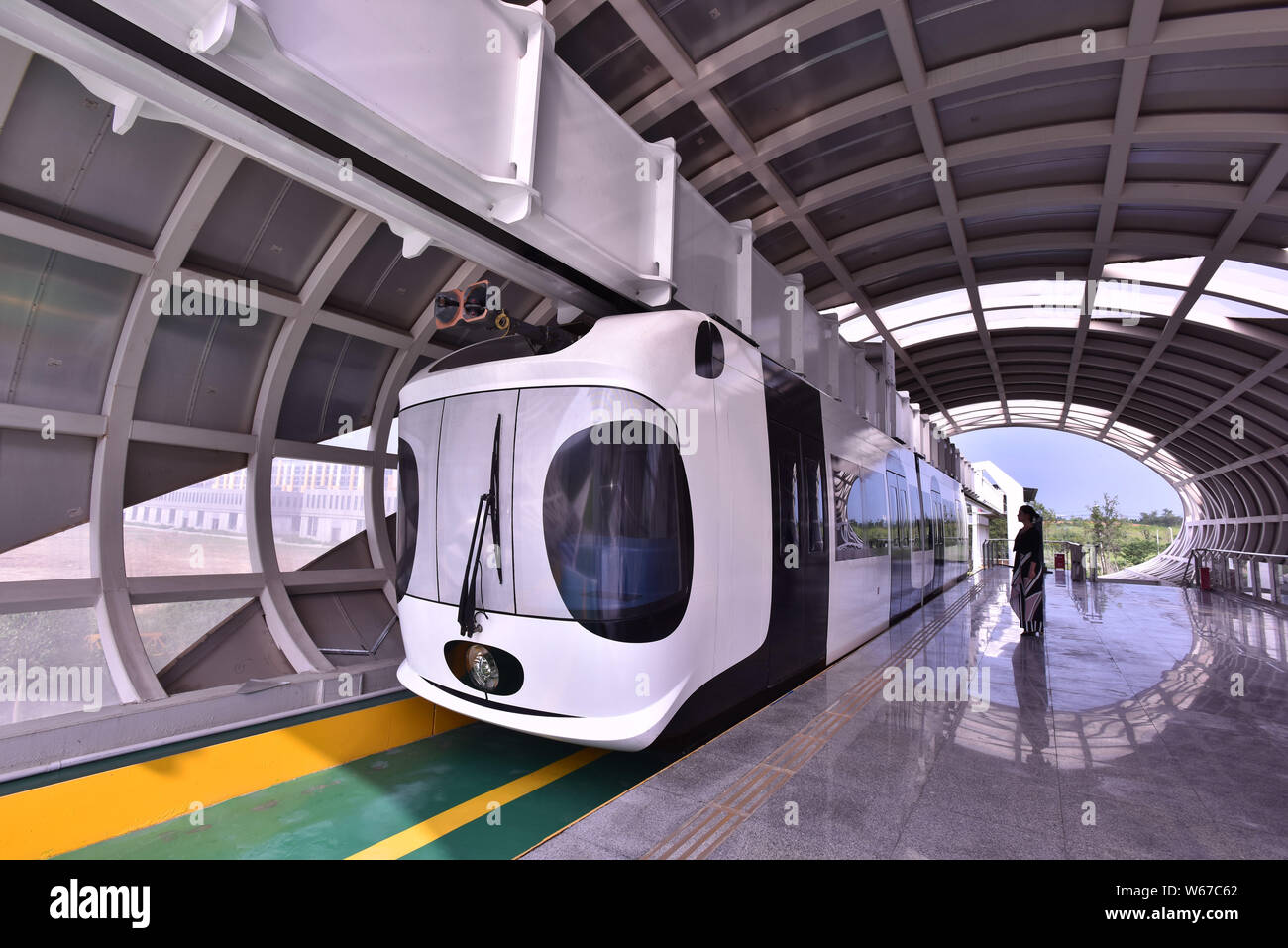 An elevated new energy monorail suspended "Sky Train" decorated to ...