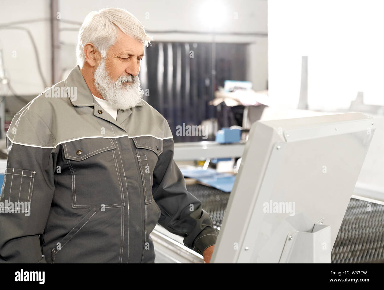 Side view serious male welder hi-res stock photography and images - Alamy