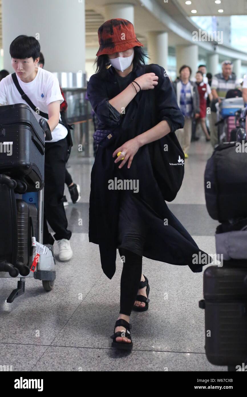 Chinese actress Zhou Xun arrives at the Beijing Capital International Airport in Beijing, China ...