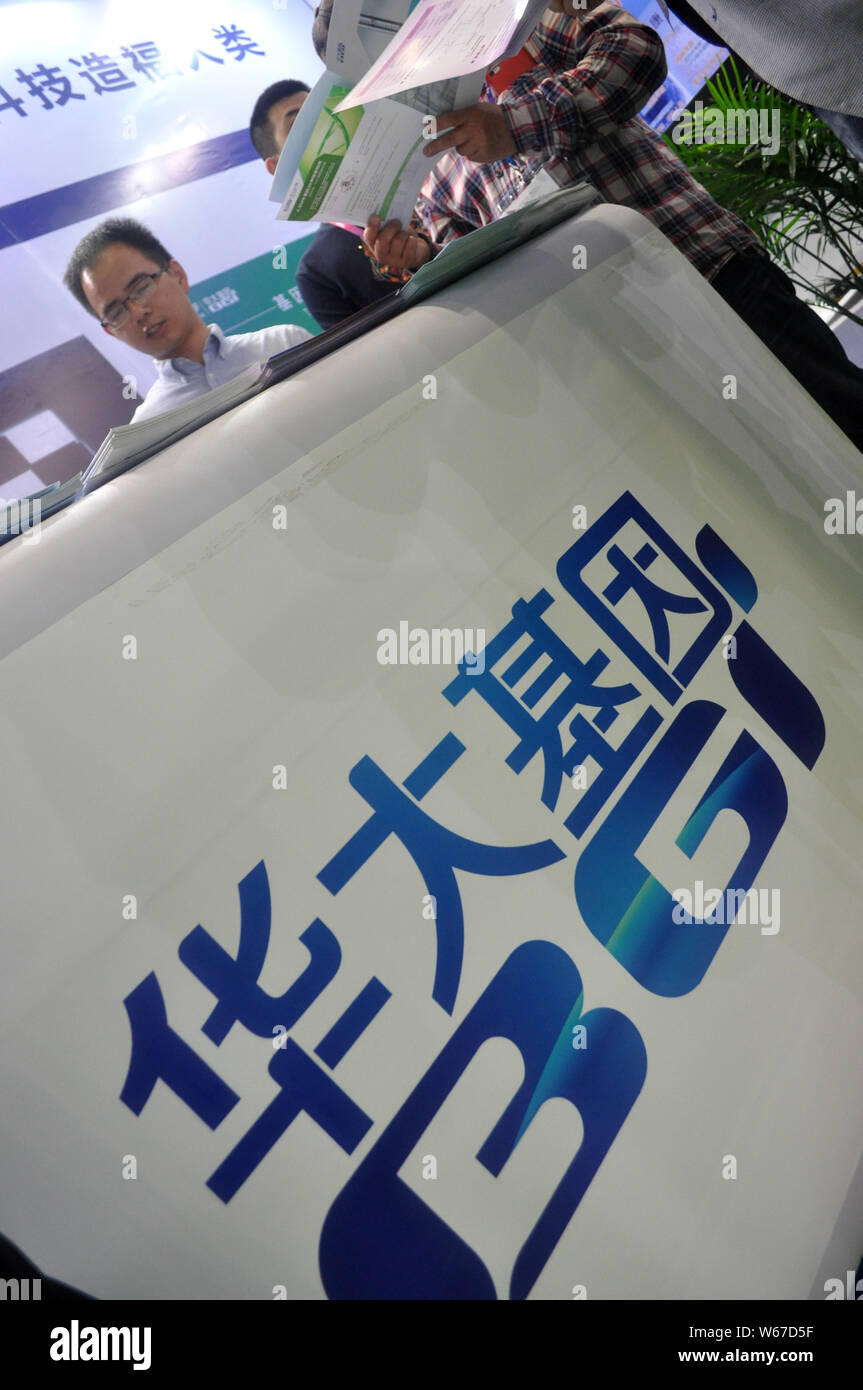 --FILE--People visit the stand of Chinese genome giant BGI Group during ...