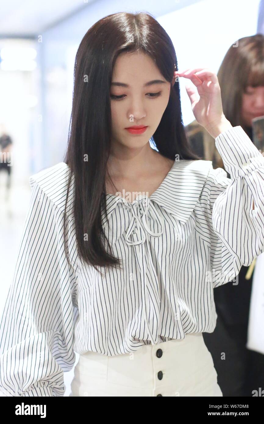 Chinese singer and actress Ju Jingyi arrives at the Beijing Capital ...