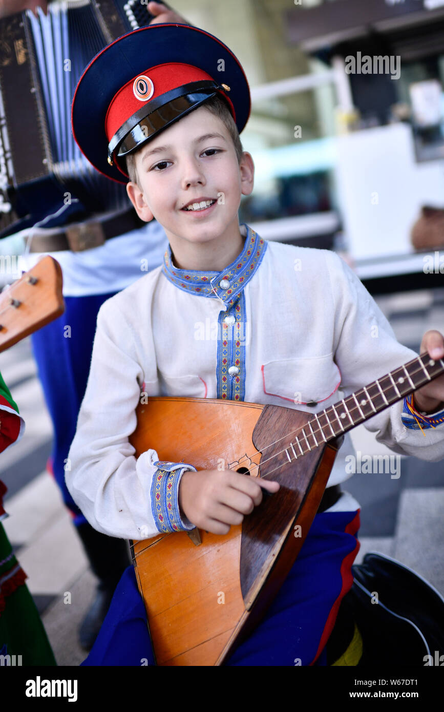 Belgian fans sing and dance with local folklore ensembles before the ...