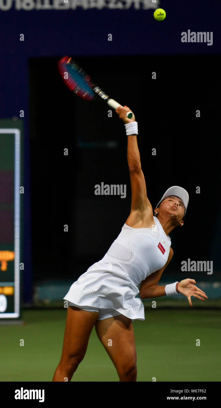 Wang Qiang of China serves against Ankita Raina of India in their women ...
