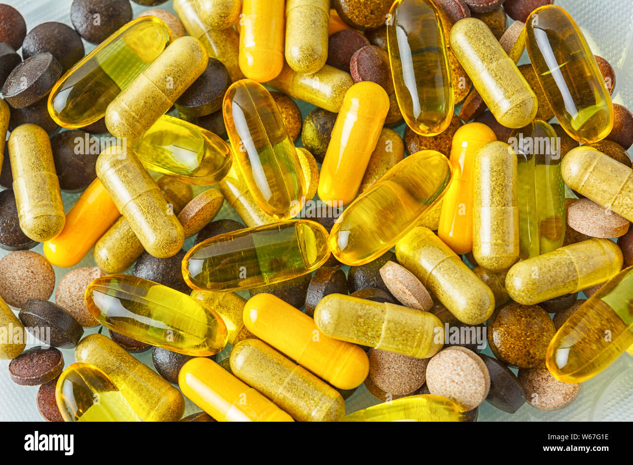 Ayurvedic pills as healthy lifestyle symbol. Vitamin capsule background ...