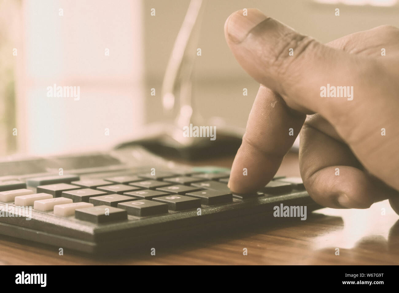 Close up of Press the right button. Calculator with finger. Fingers ...