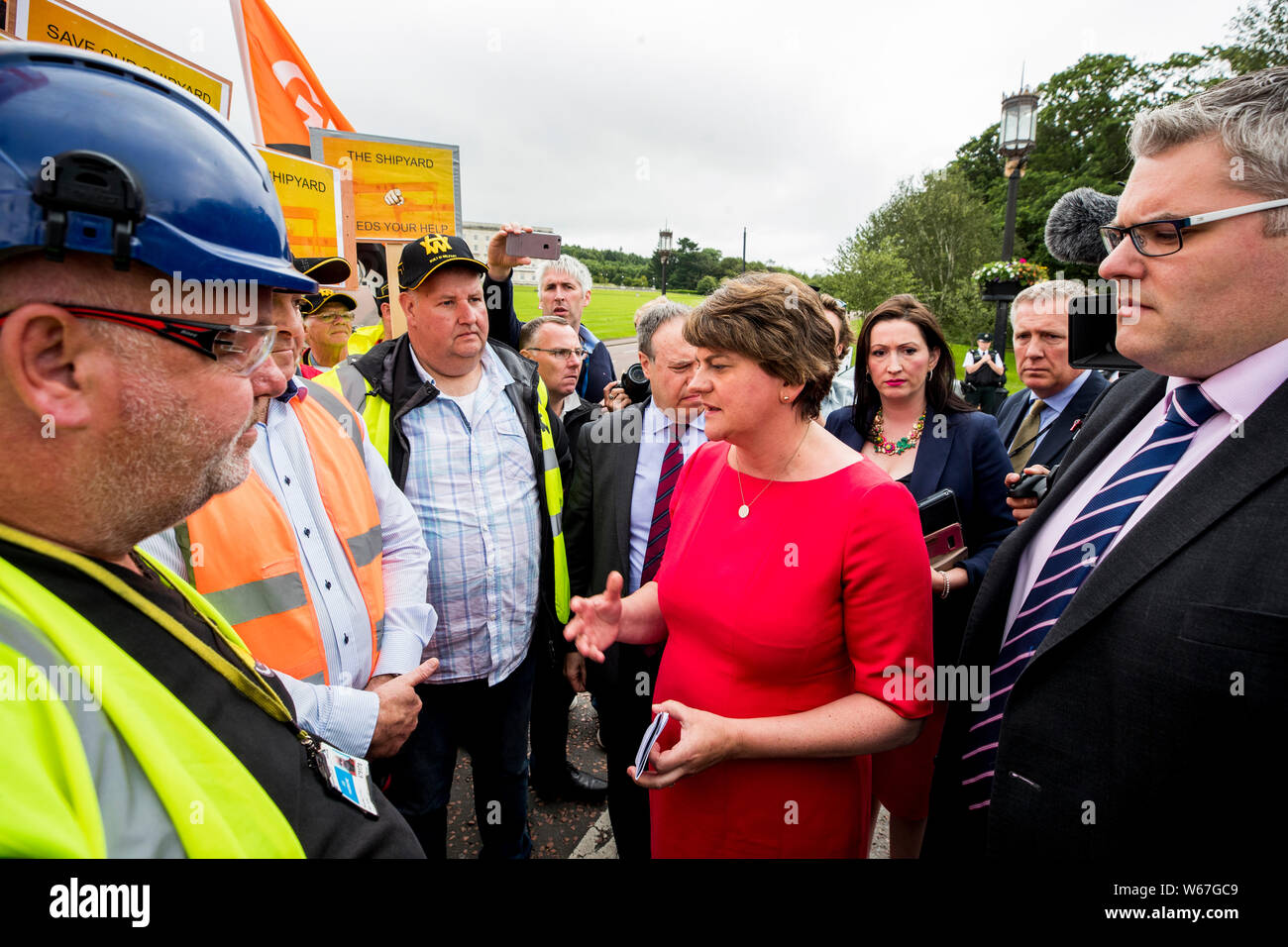 DUP Leader Arlene Foster and Gavin Robinson (right) speak with ...