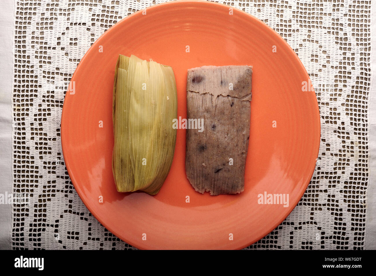Top view of bean tamale, wrapped on corn leaf. A traditional Mexican ...