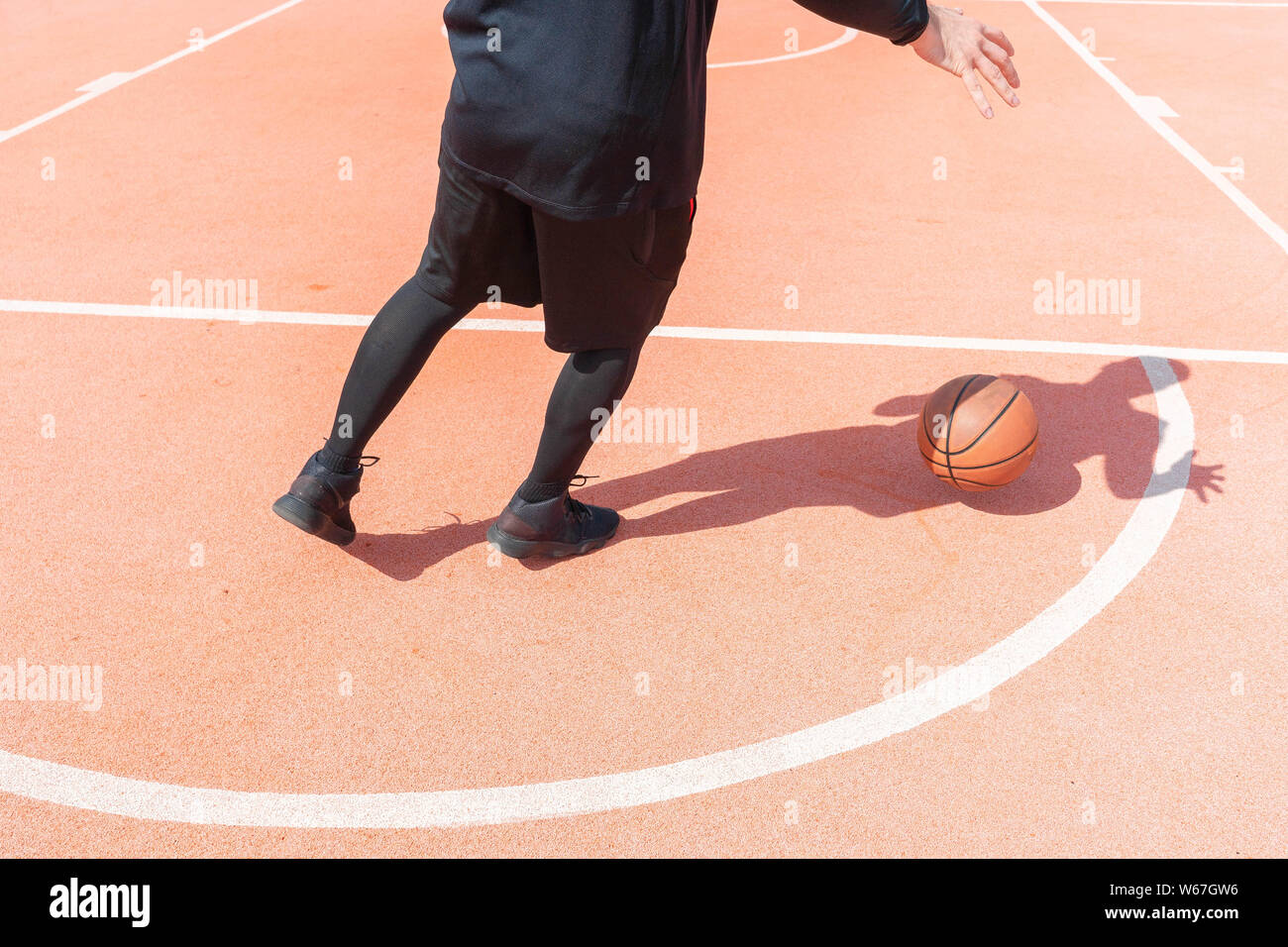 Shadow man playing basketball basketball court hi-res stock photography ...