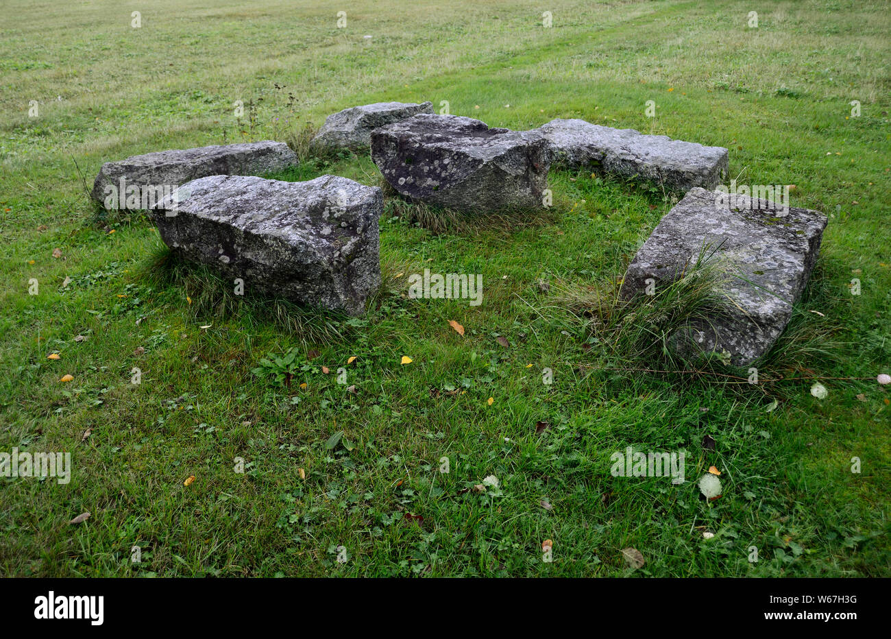 landscape design, six large stones on a green field Stock Photo - Alamy