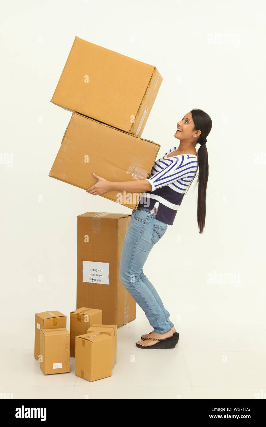 Woman picking up boxes hi-res stock photography and images - Alamy