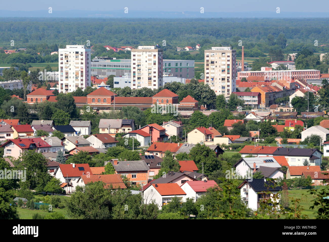 Landscape of old european city with houses industrial buildings and ...