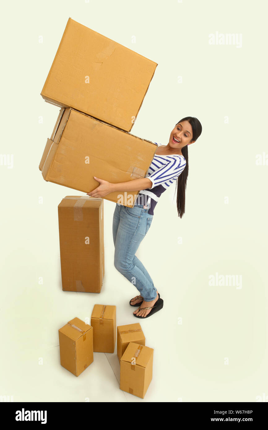 Woman picking up boxes hi-res stock photography and images - Alamy