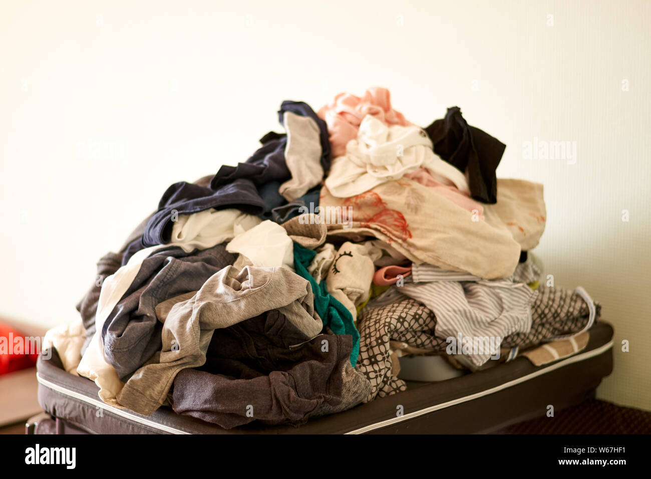 Overflowing laundry basket hi-res stock photography and images - Alamy