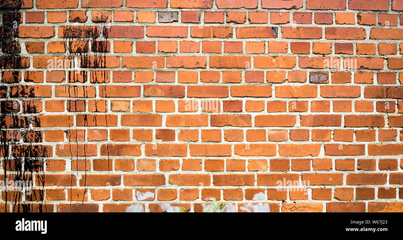 brick wall with black tar blur Stock Photo - Alamy