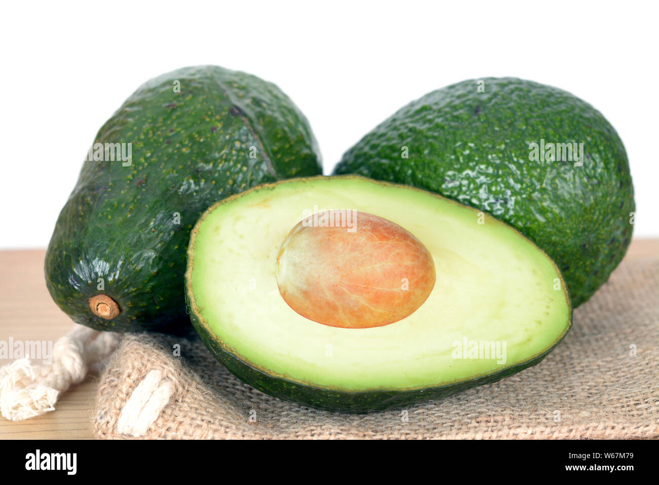 fresh full and section avocado showing at market place Stock Photo - Alamy