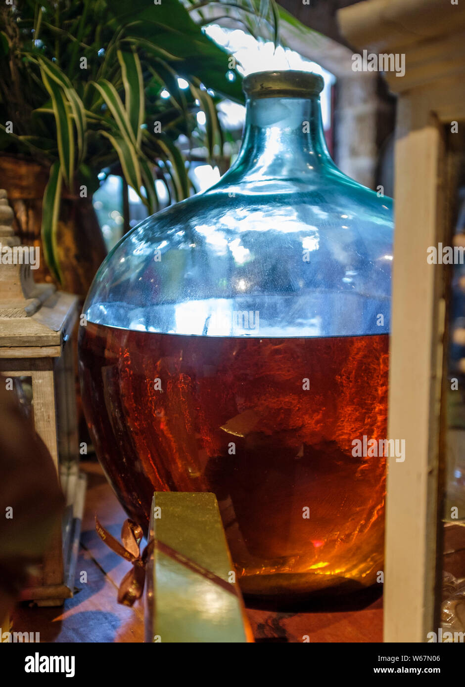 A large glass bottle of rum, on display at St Nicholas Abbey, an ...
