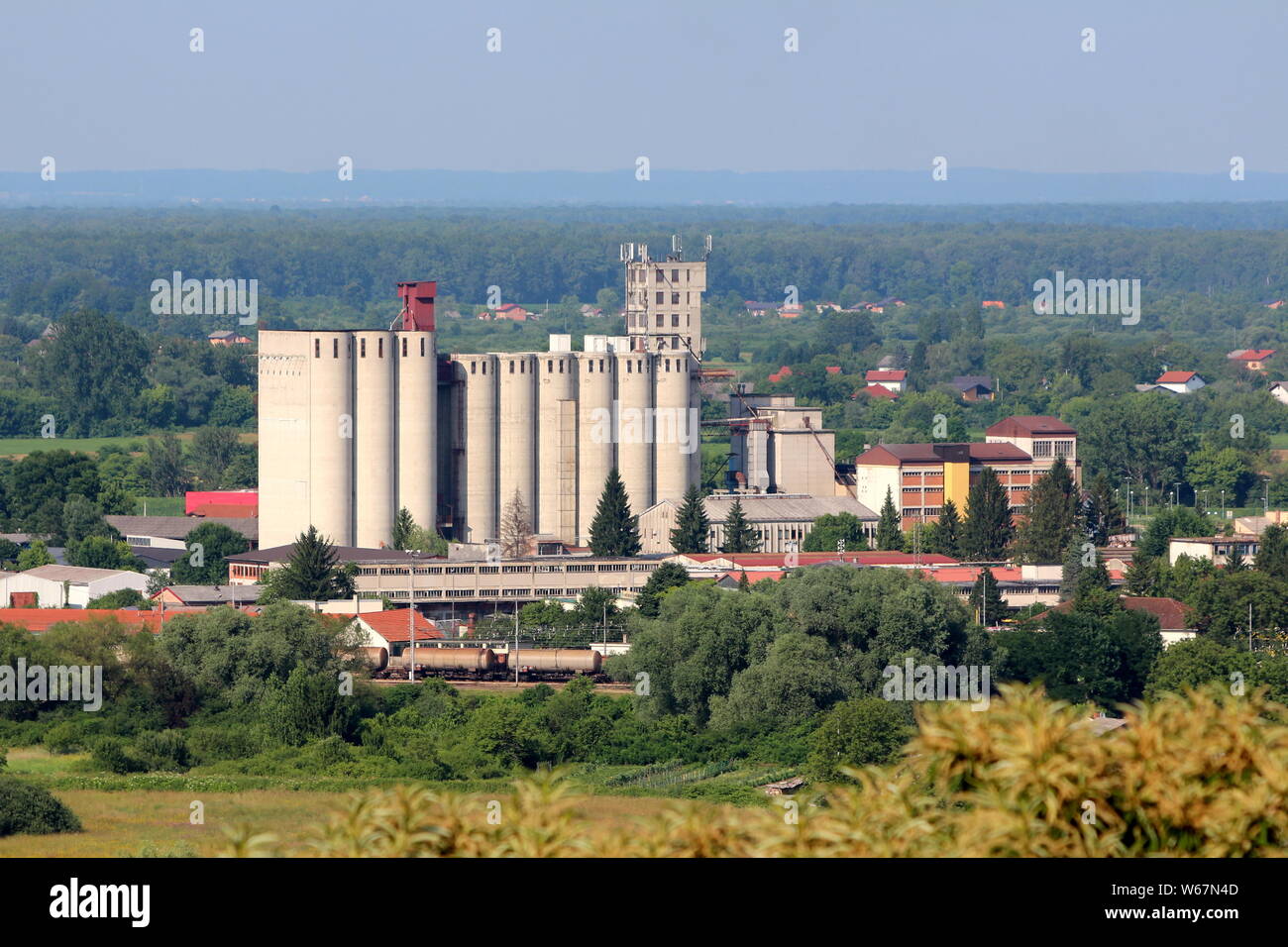 Tall concrete storage silos made as one large building at local ...