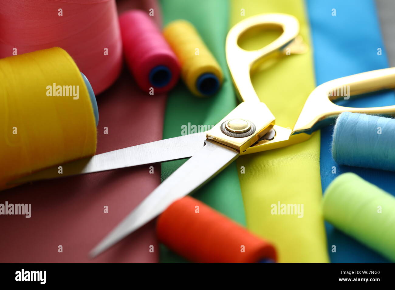 Metallic scissors on table Stock Photo - Alamy