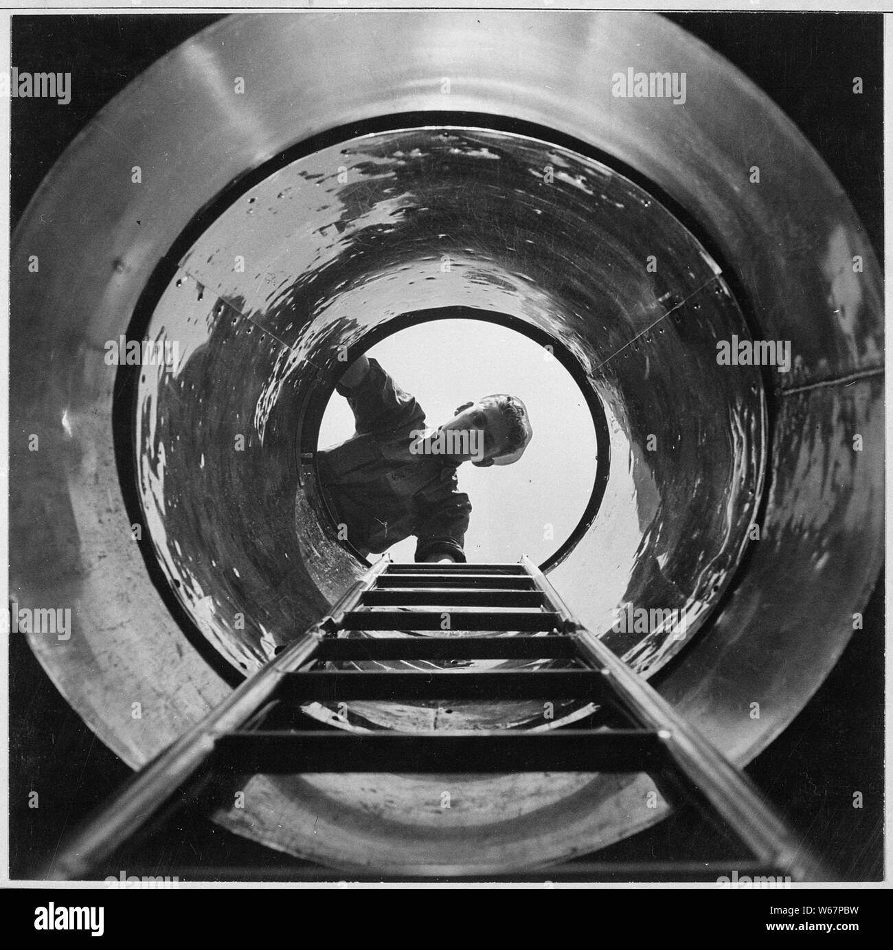 On board the USS MARLIN at New London, Connecticut Sailor looks down ...