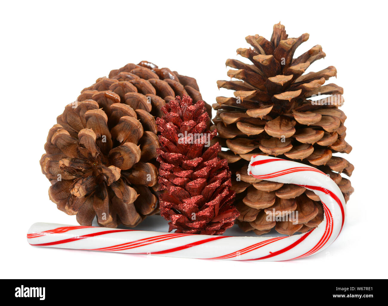 candy cane and pine cone isolated on white Stock Photo - Alamy
