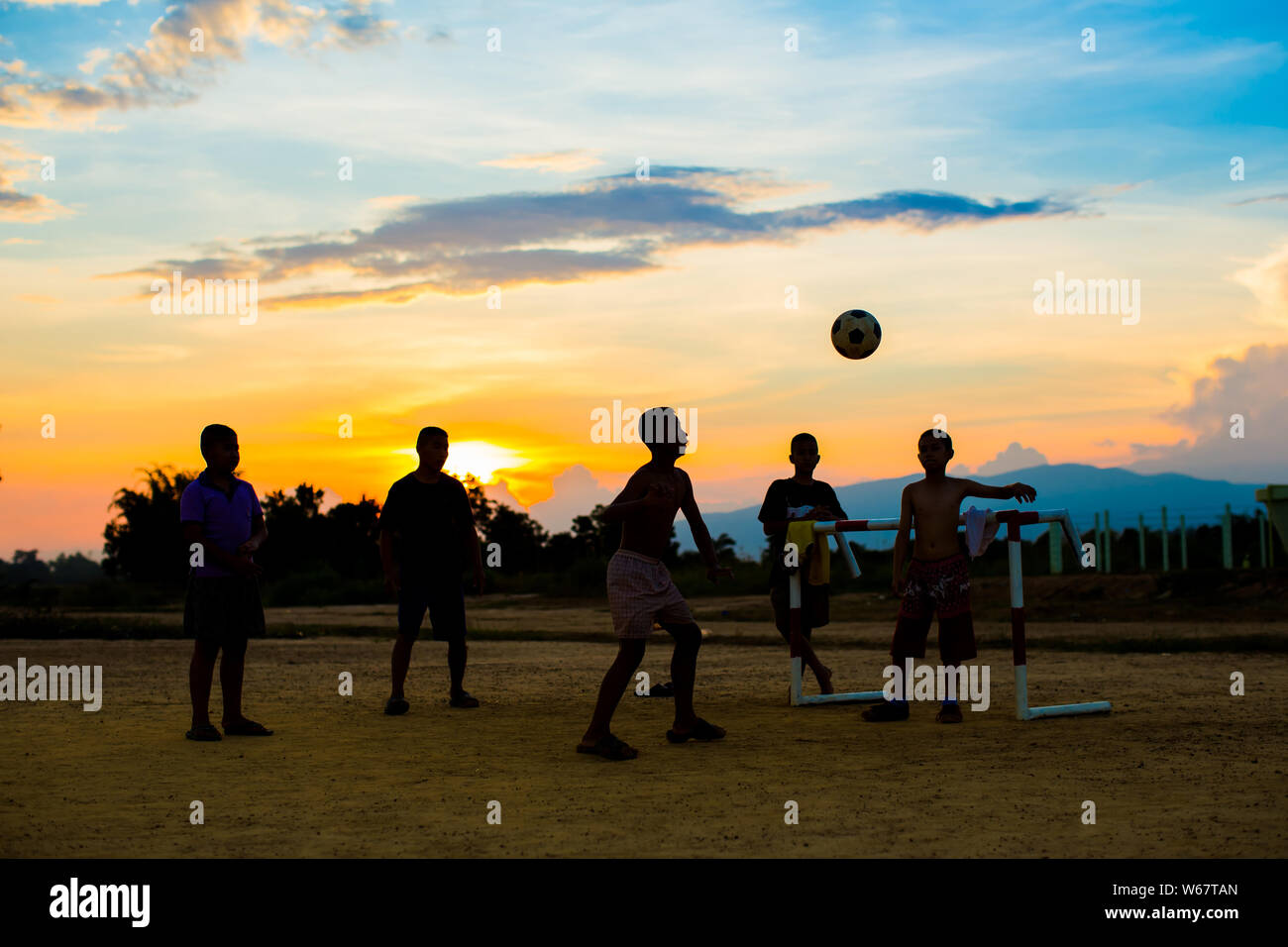 action sport outdoors of kids playing soccer football for exercise in ...