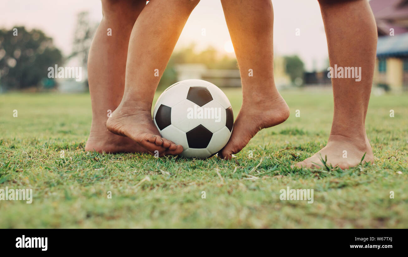 Silhouette action sport of kids having fun playing soccer football for ...