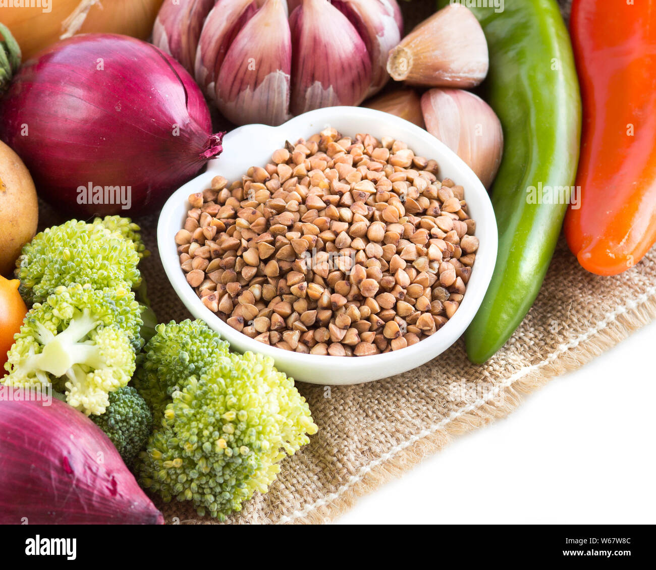 Raw buckwheat and vegetables isolated on white Stock Photo - Alamy