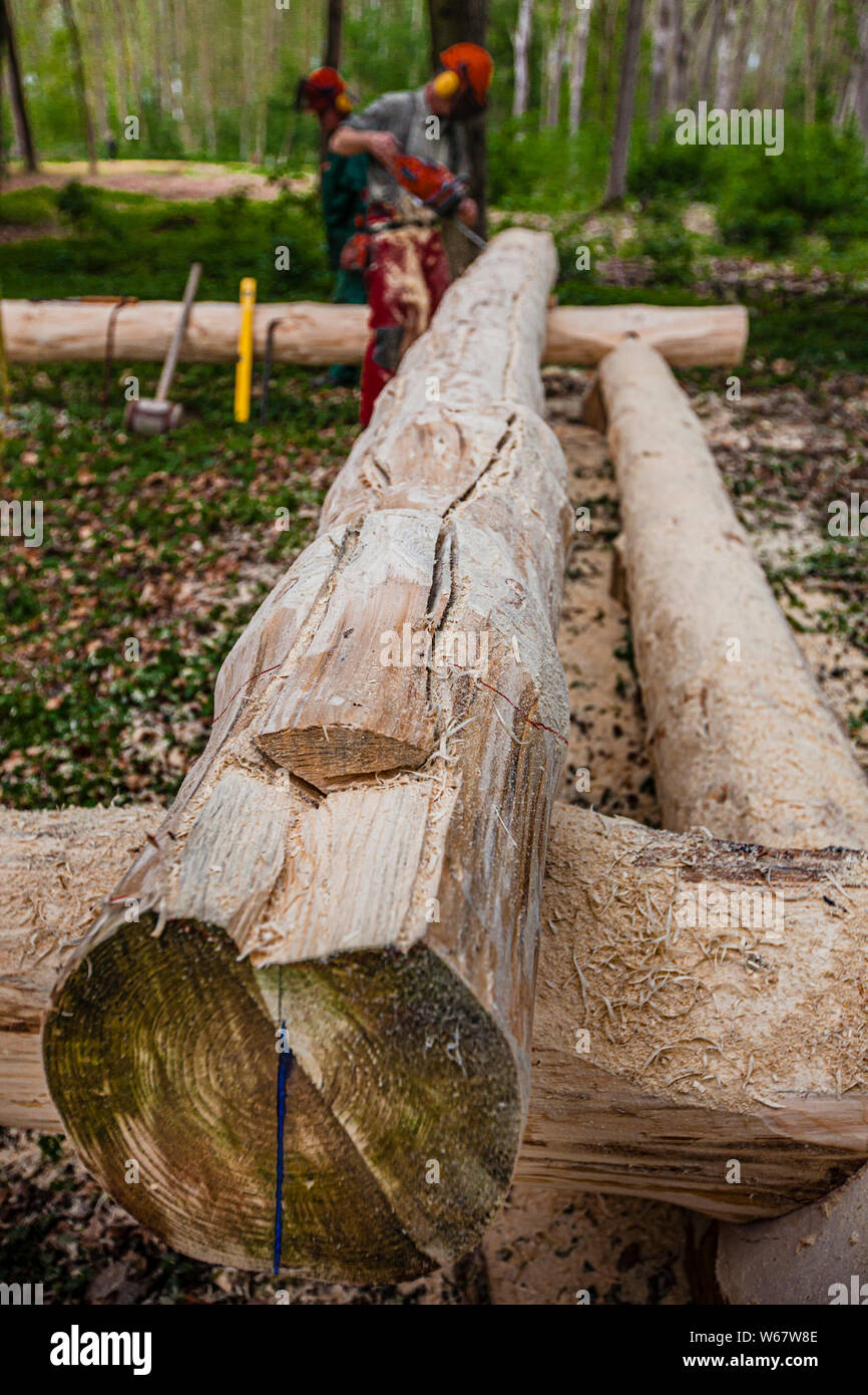 Building a log house with chainsaw and traditional carpenter tools in ...