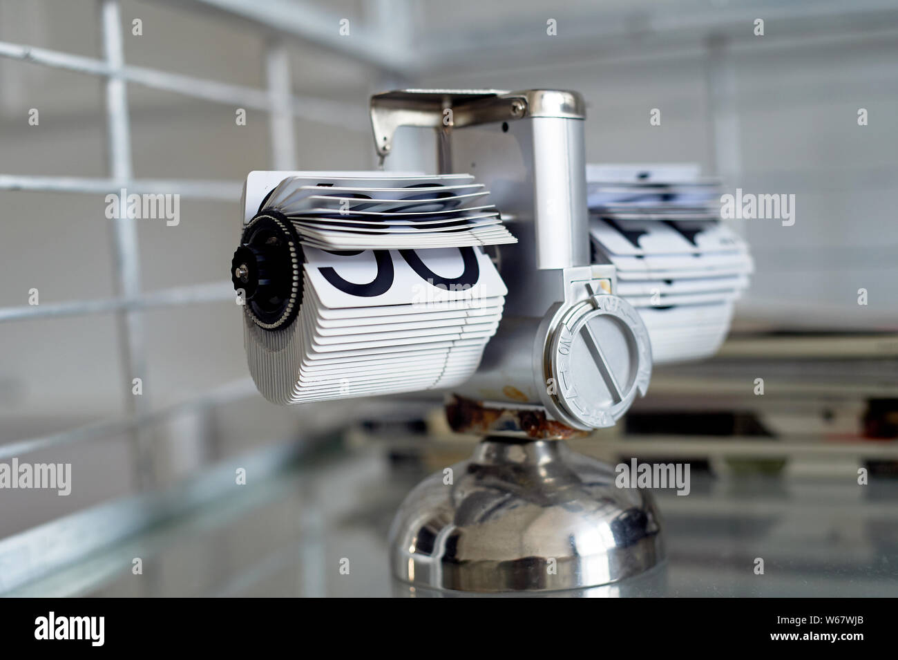Classic flip clock on a metal stand in the interior.The theme of time ...