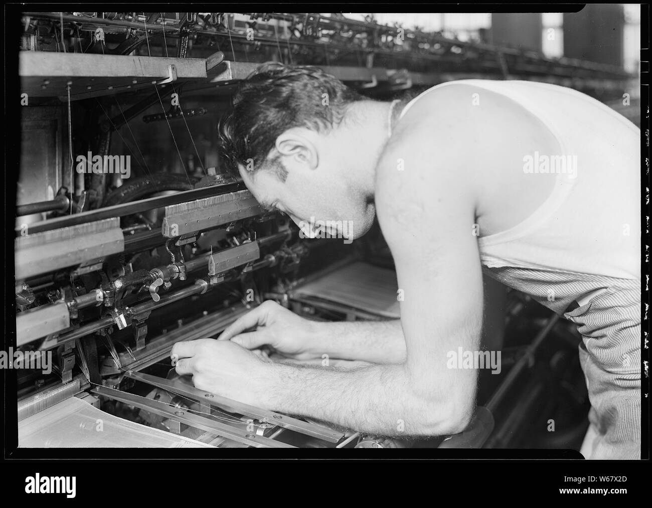 Philadelphia, Pennsylvania - Hosiery. Minnesac Mills. [Man bending over ...